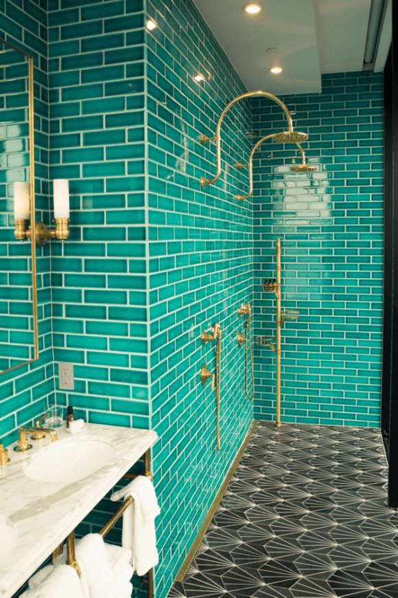 shower-with-emerald-green-wall-tile-and-black-tile-floor-brass-fixtures ...